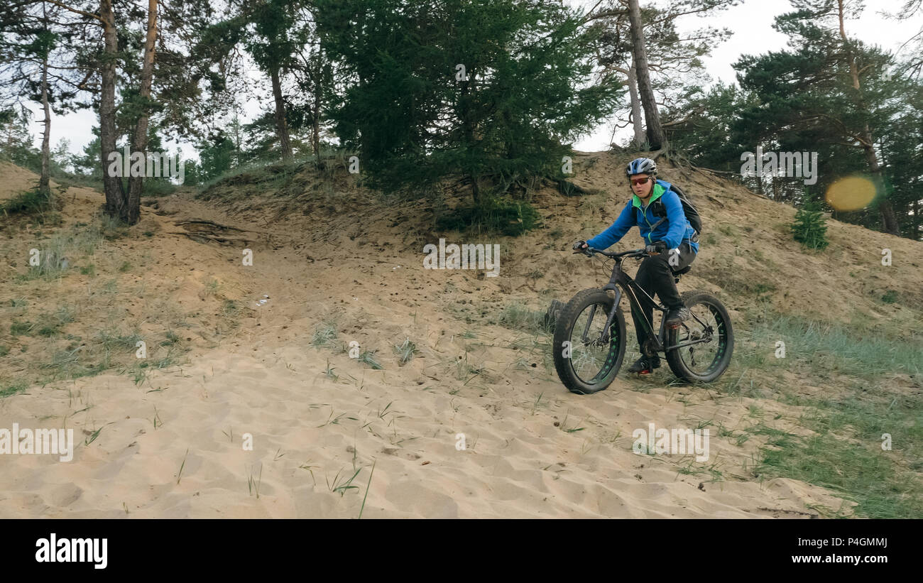 Fat bike also called fatbike or fat-tire bike in summer driving through ...