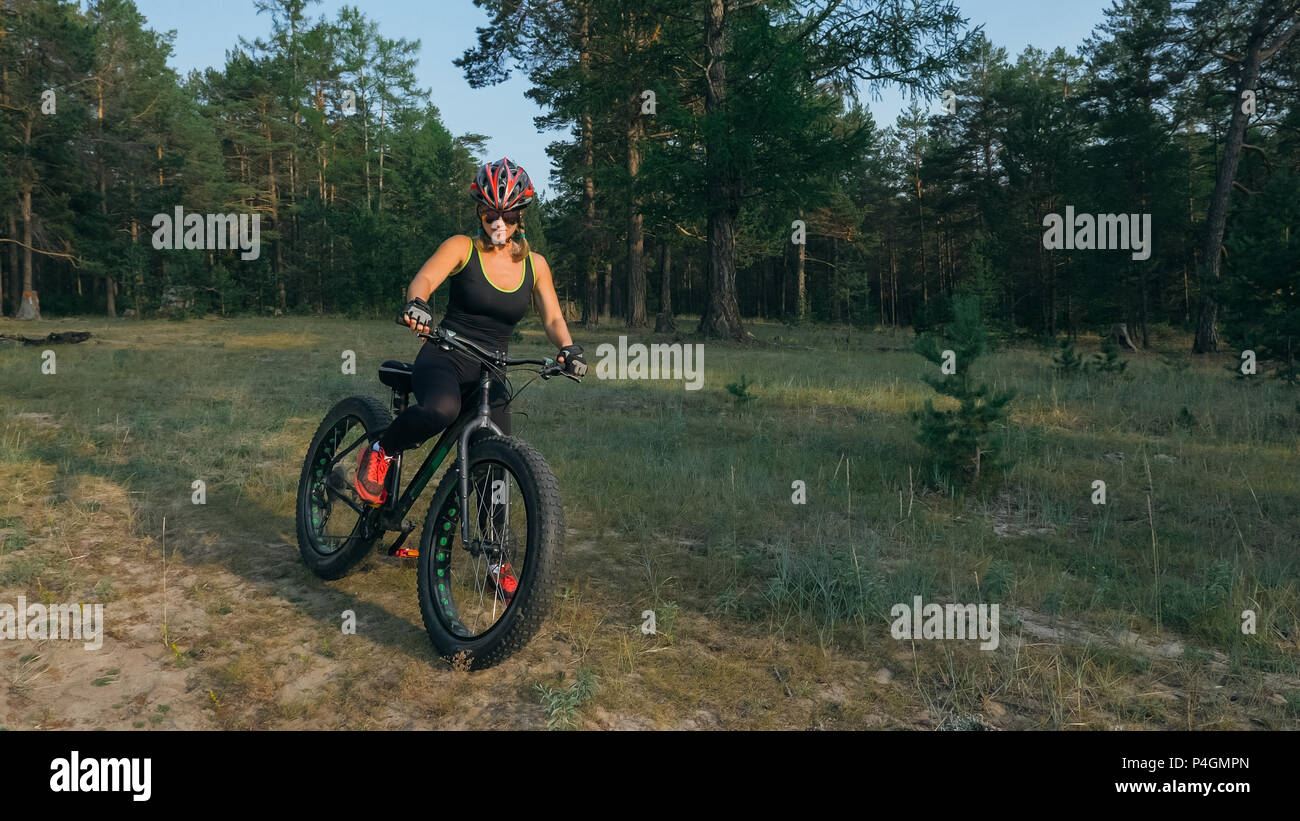 Fat bike also called fatbike or fat-tire bike in summer riding in the ...