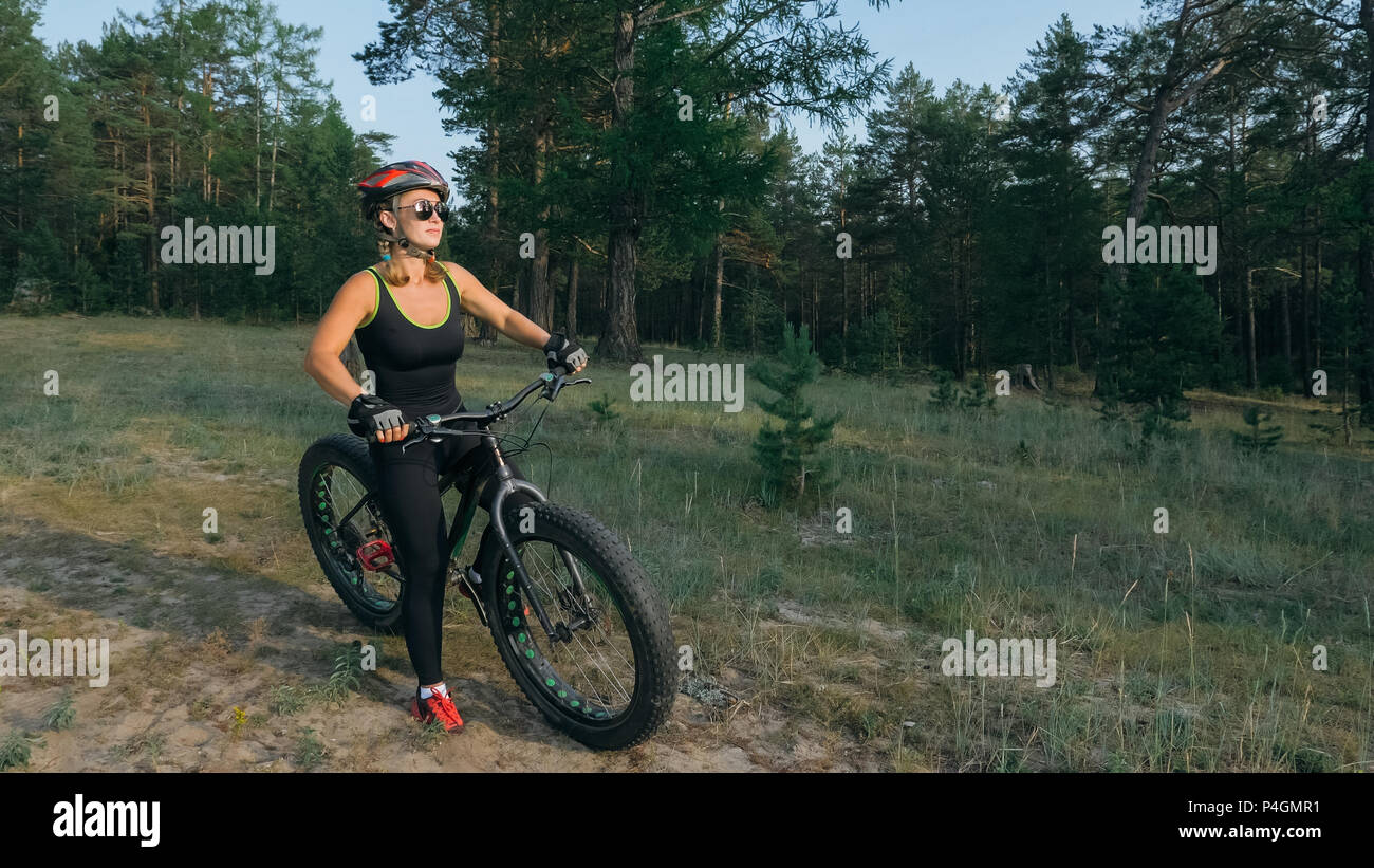 Fat bike also called fatbike or fat-tire bike in summer riding in the ...