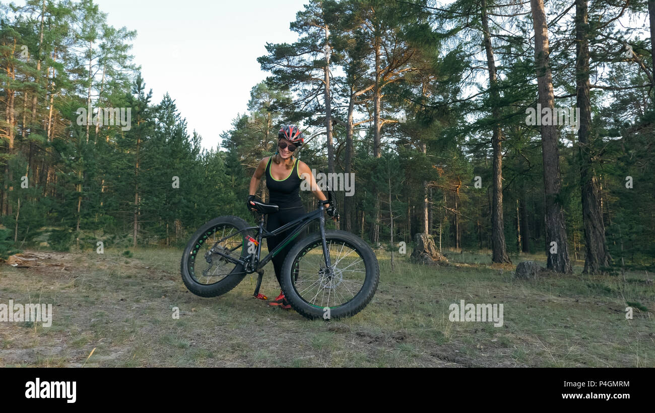 Fat bike also called fatbike or fat-tire bike in summer riding in the ...