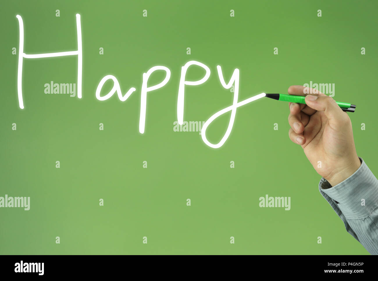 hand of a businessman writing a letter of Happy on green background for ...