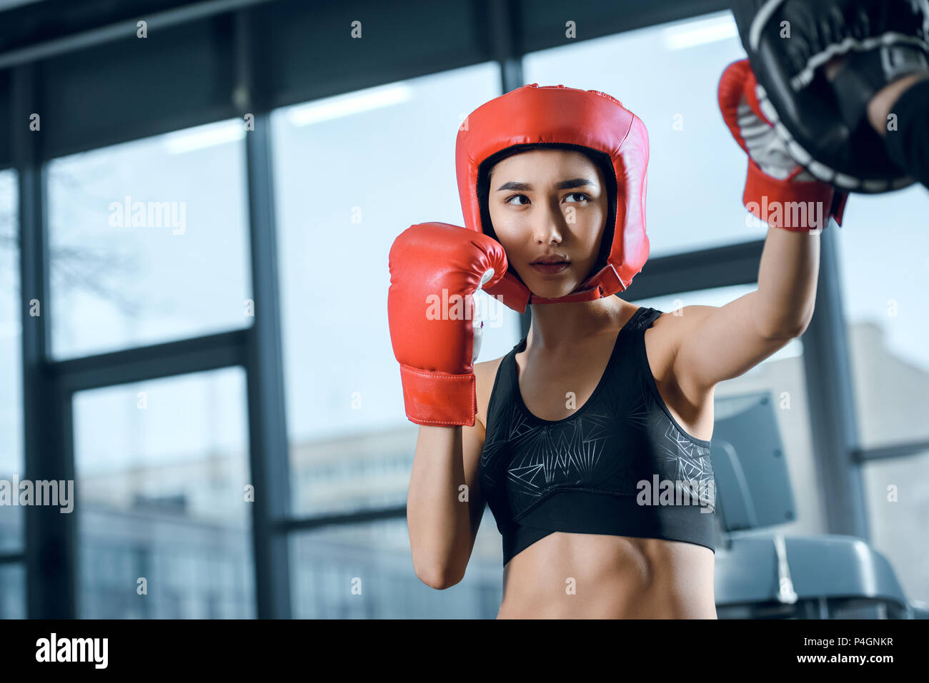 equiped young female boxer training at gym Stock Photo - Alamy