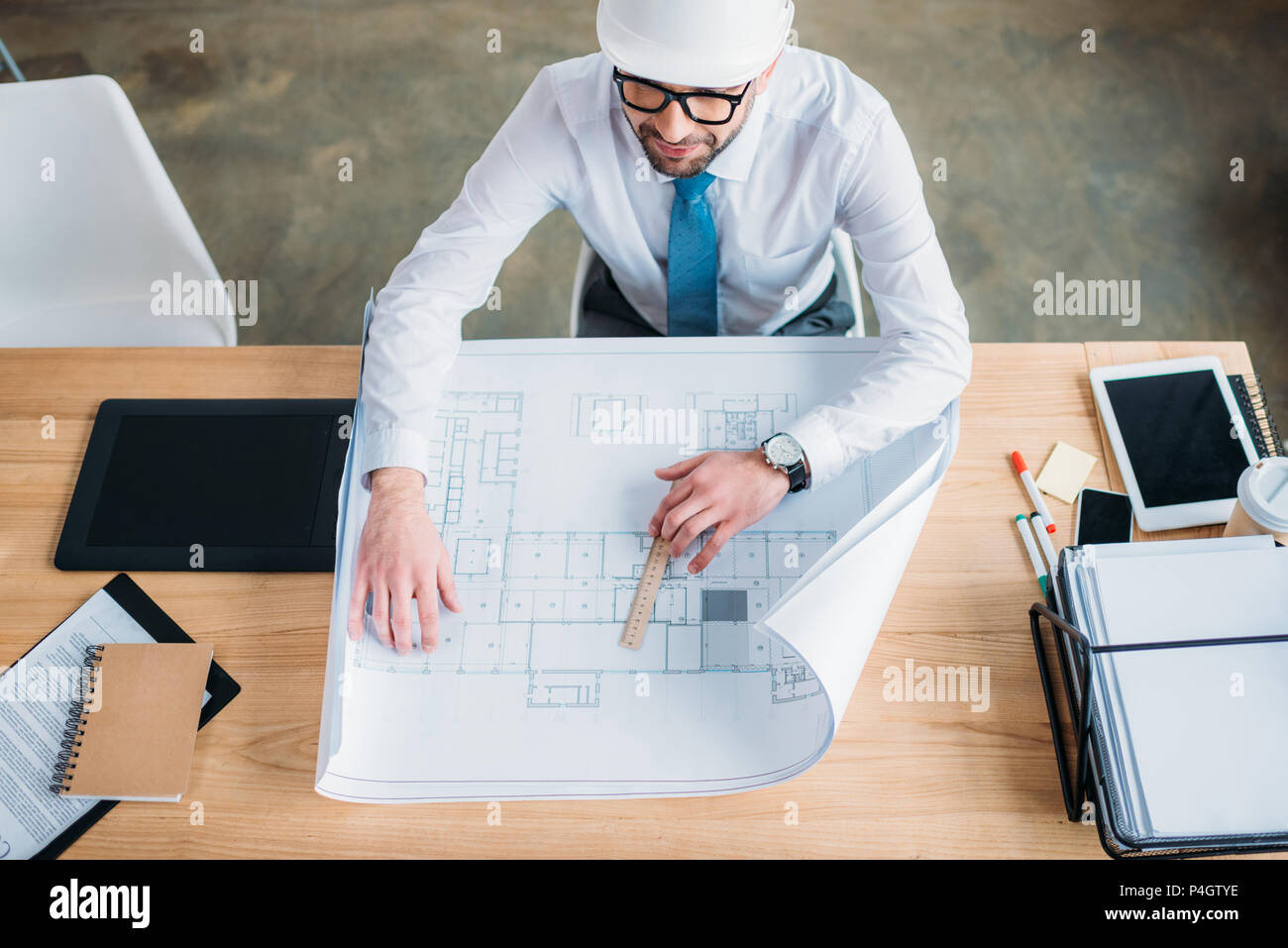 handsome professional architect drawing building plan Stock Photo - Alamy