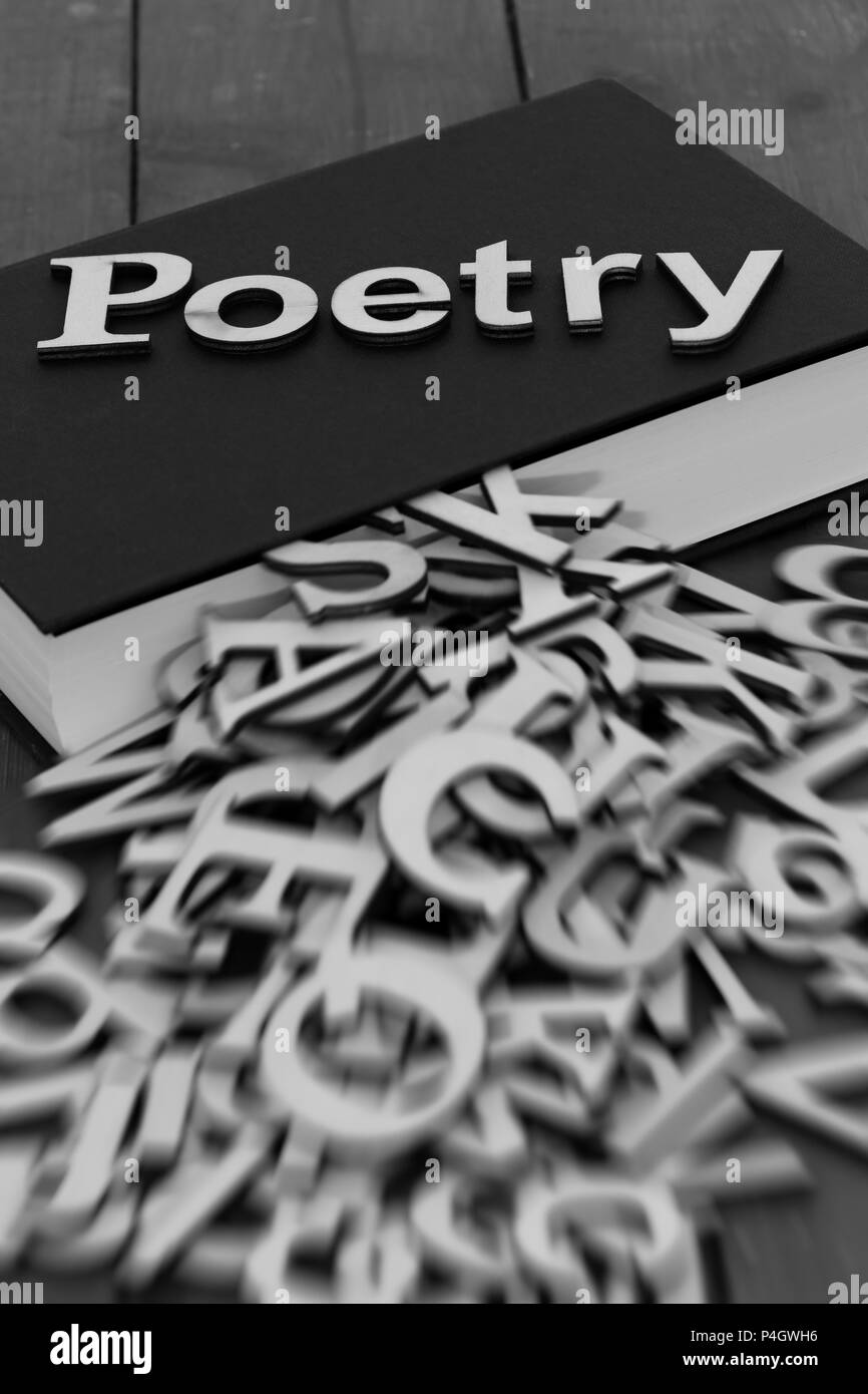 Book novel with the word poetry and blurred letters coming out of the ...