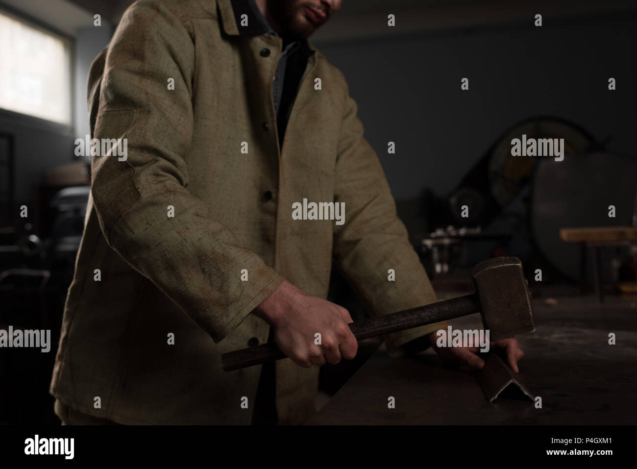 Worker hammering hi-res stock photography and images - Alamy