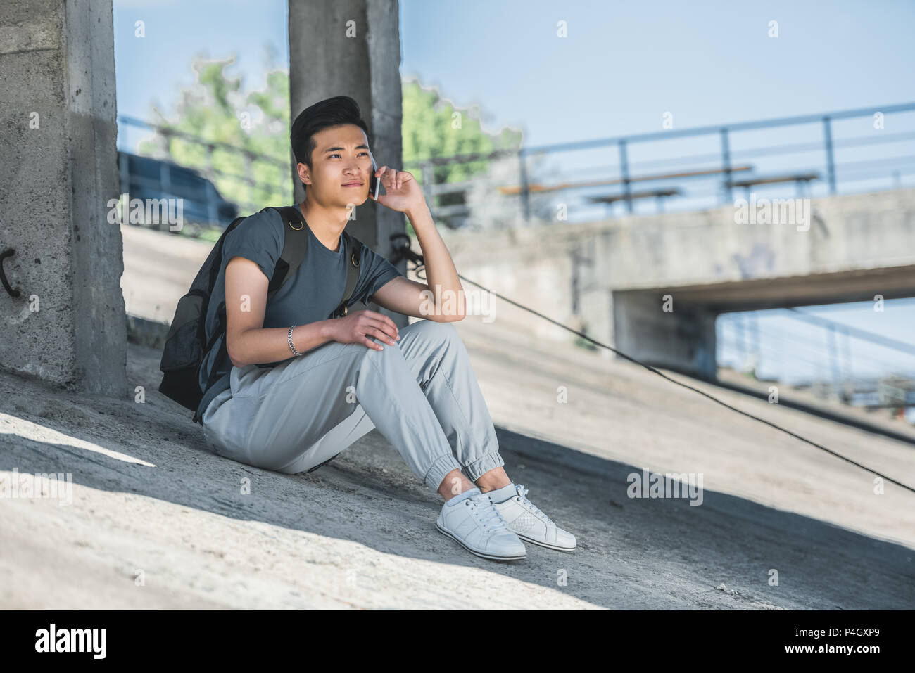 Man sitting under bridge hi-res stock photography and images - Alamy