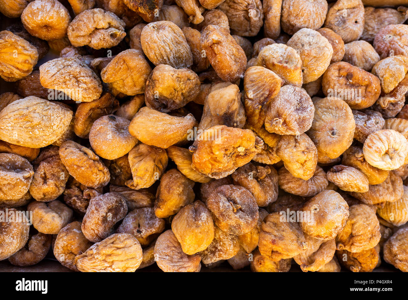 dried figs folded in large quantities on the counter, vegetative ...