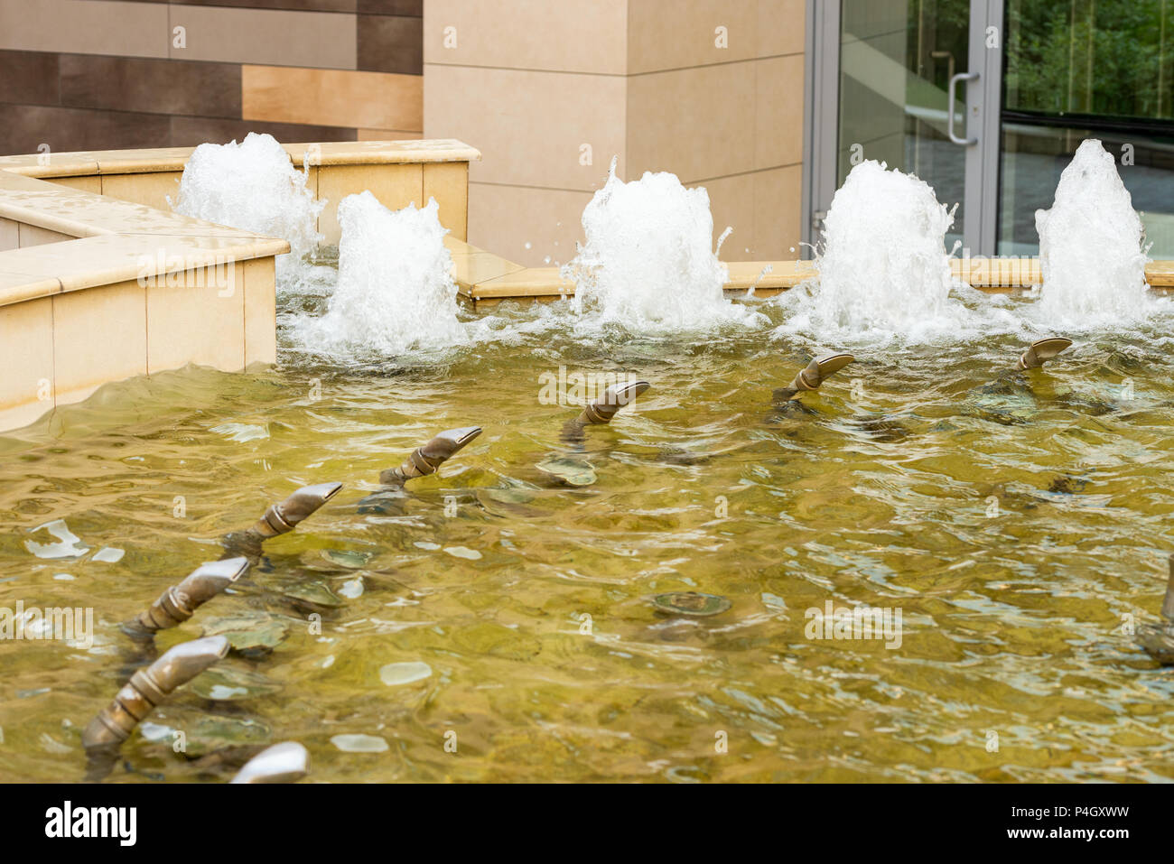 The flow of water in a working fountain Stock Photo - Alamy