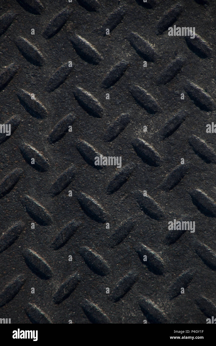 Closeup of distressed, mottled, grungy industrial checker plate rusty ...