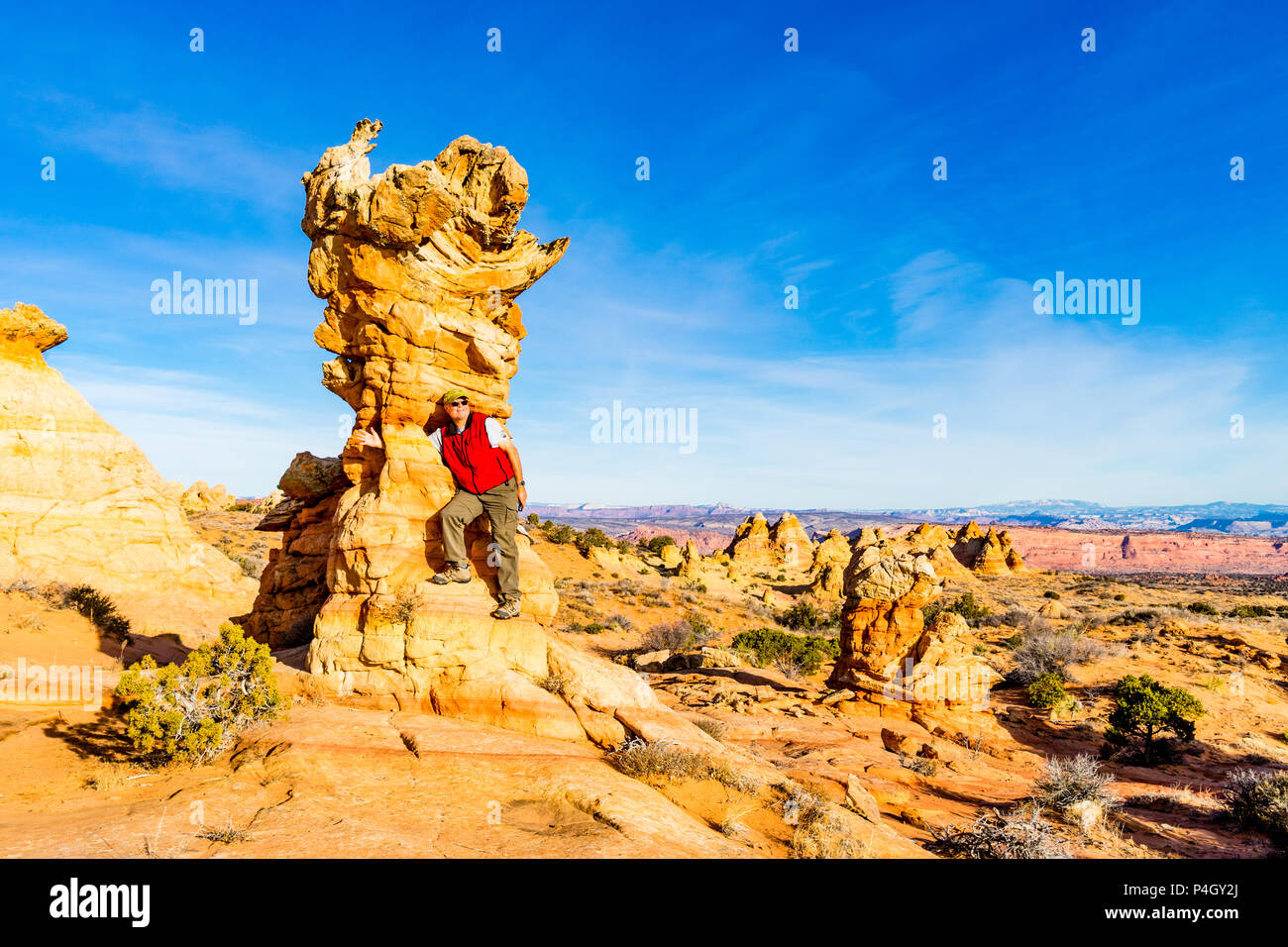 Man standing by unique sandstone formation hi-res stock photography and ...