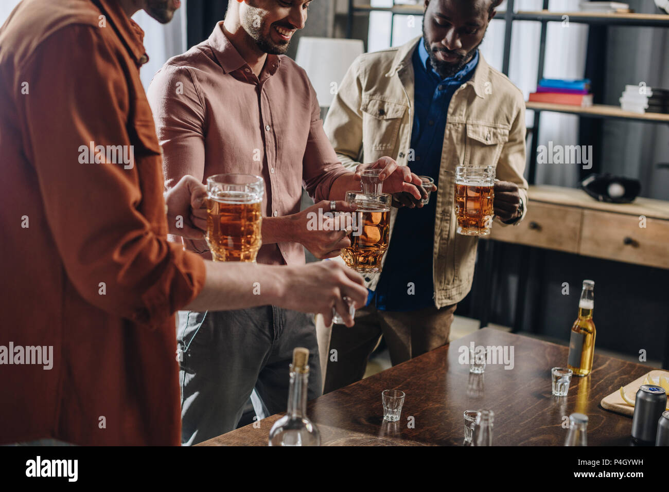 Stag party with happy group of young men drinking beer hi-res stock ...