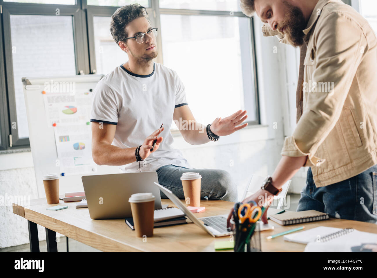 Professional business male colleagues in modern office Stock Photo - Alamy