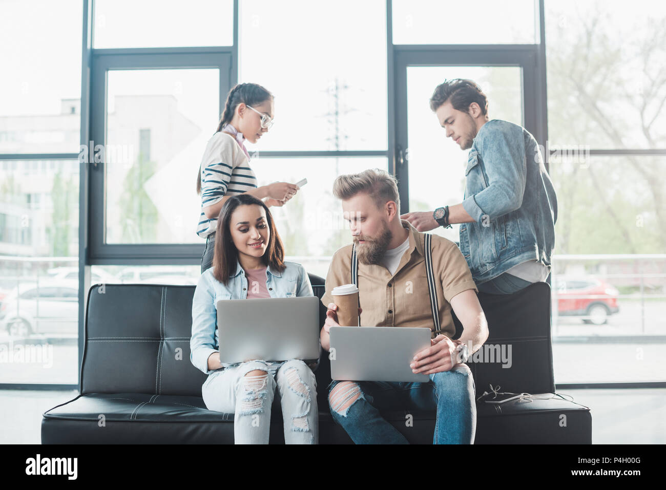 Diverse team working on laptops hi-res stock photography and images - Alamy