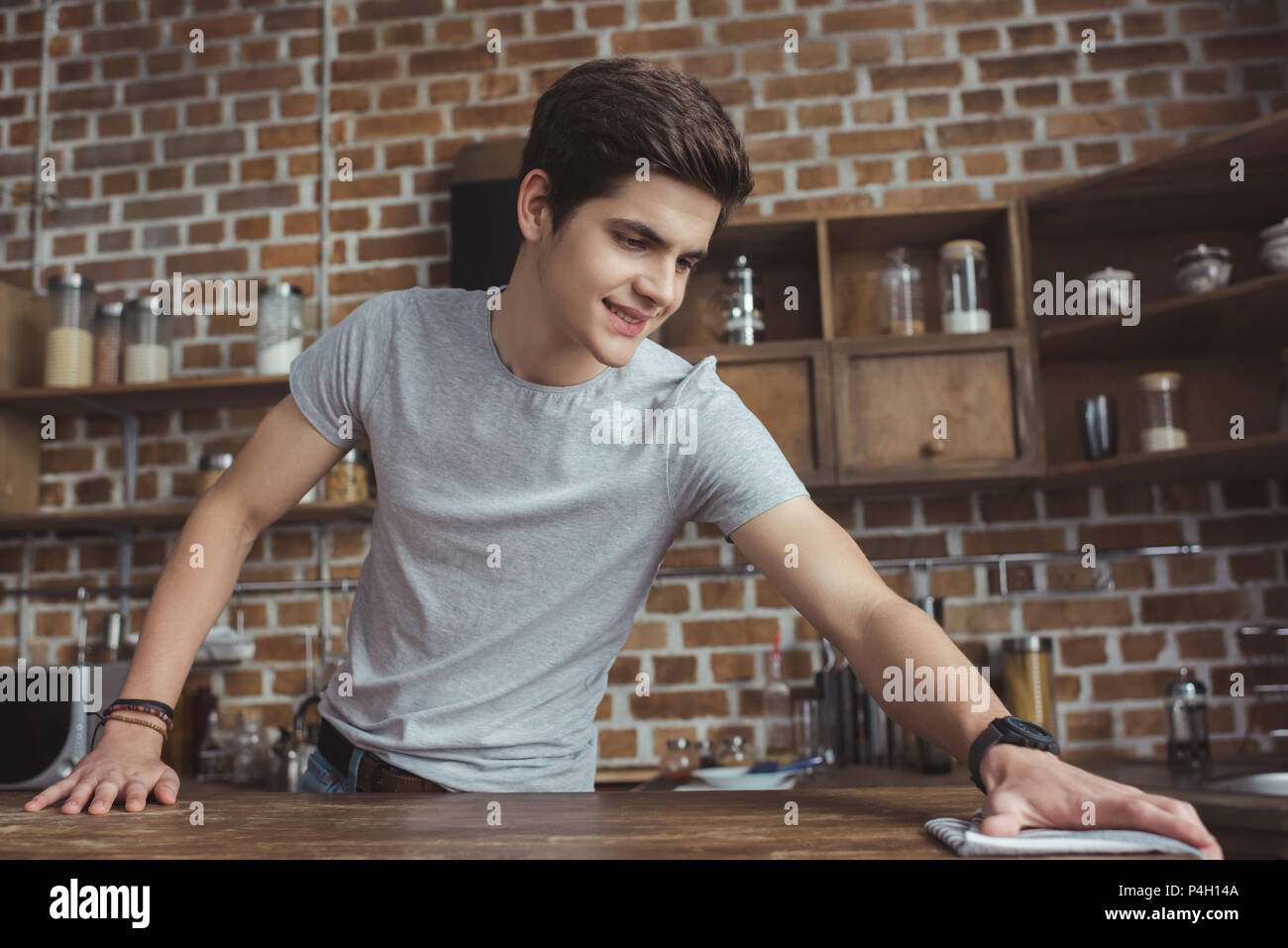 Boy cleaning table hi-res stock photography and images - Alamy