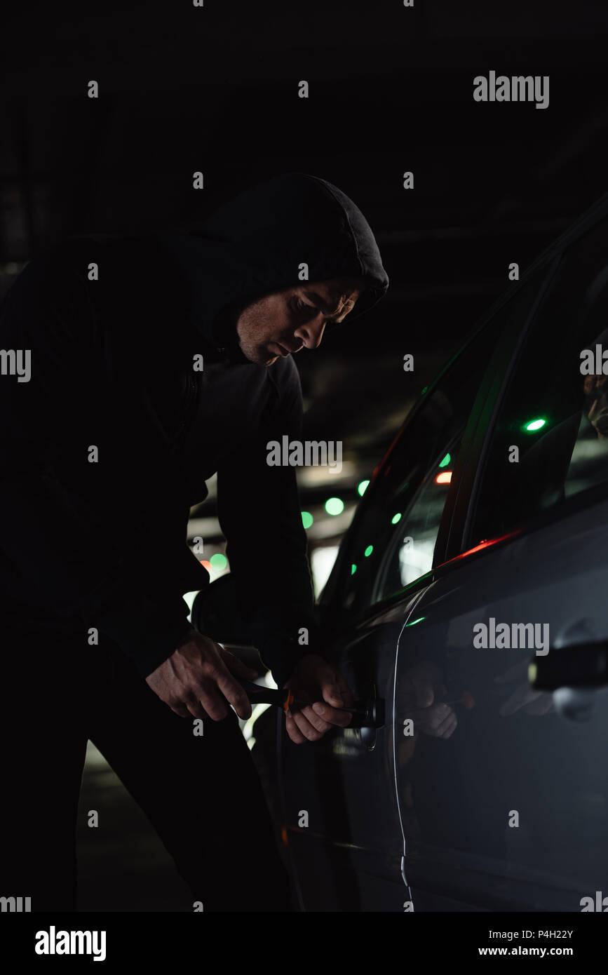 Serious criminal in black burglar hi-res stock photography and images ...