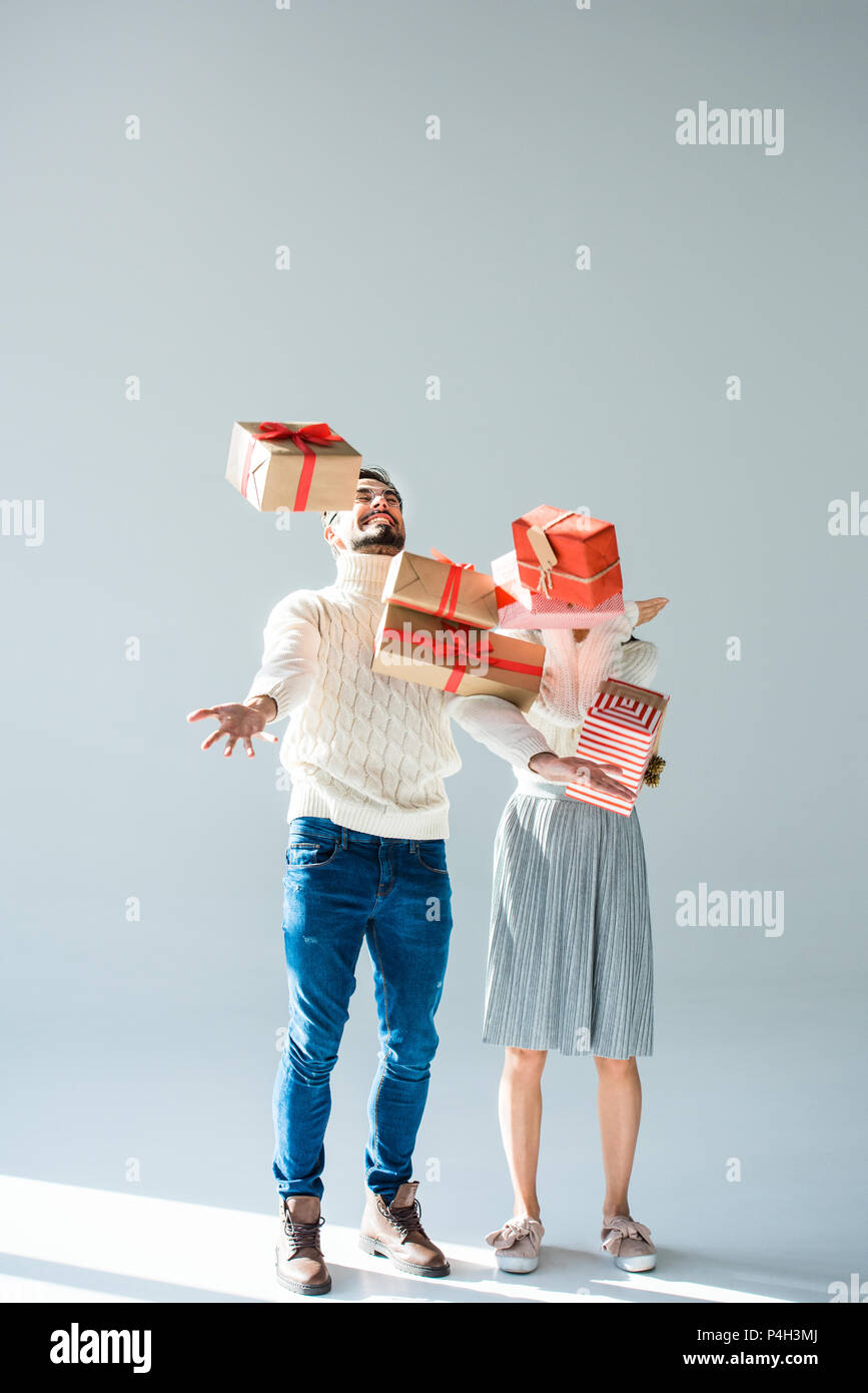 Woman catching christmas gift boxes hi-res stock photography and images ...