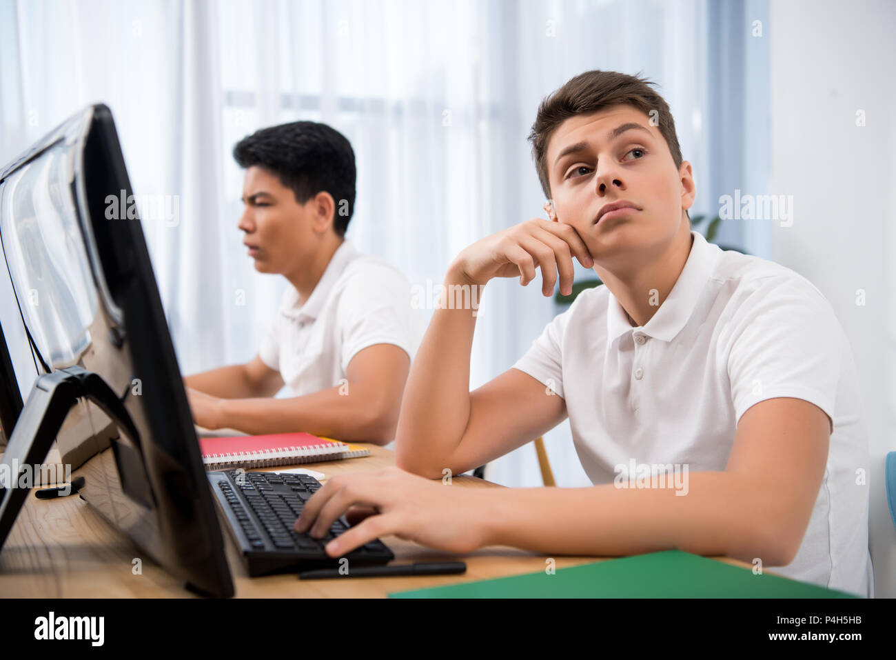young teenager boys studying on computers Stock Photo - Alamy