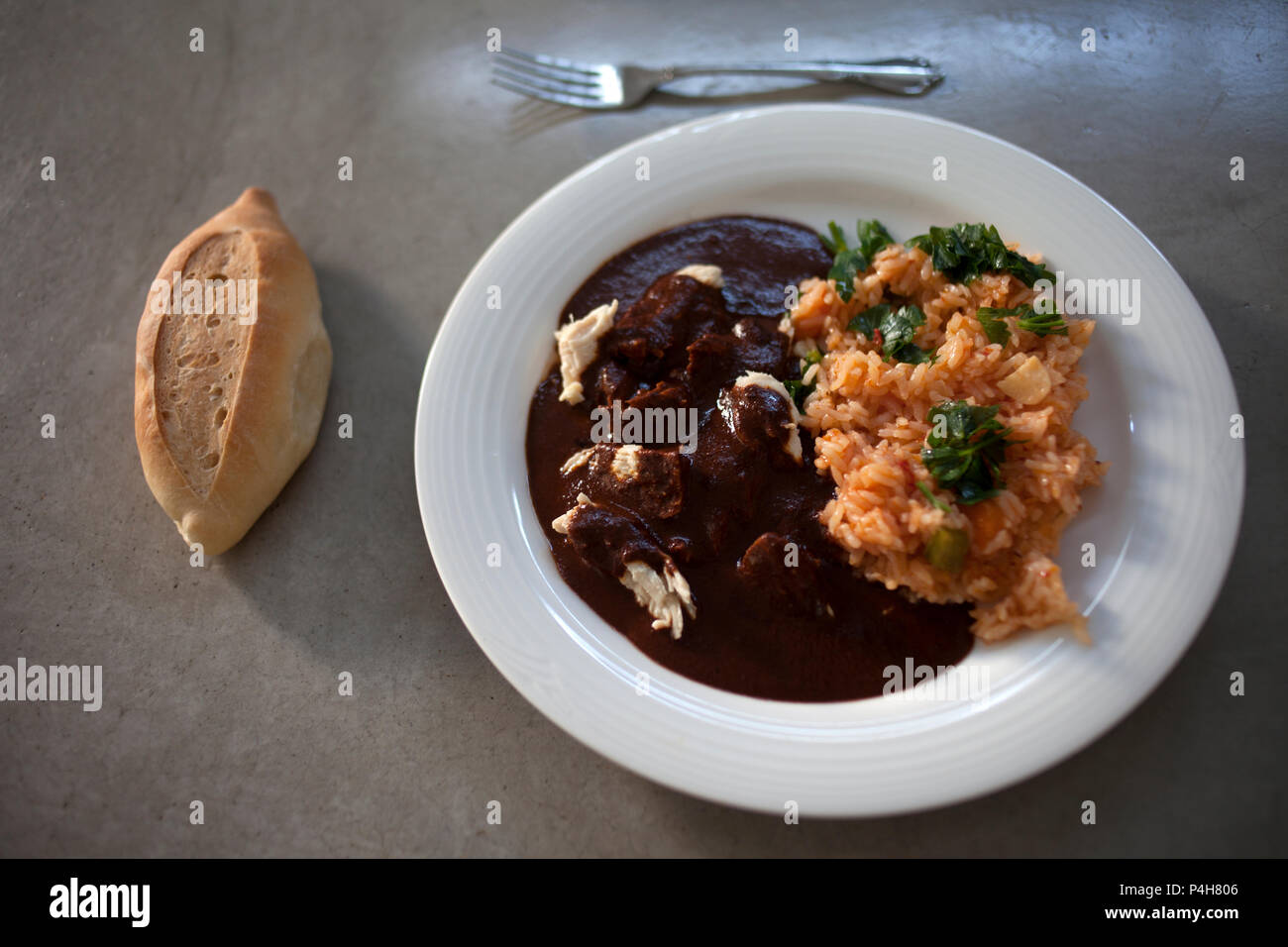 White bread, chicken, mole negro and rice in a house in Todos Santos ...