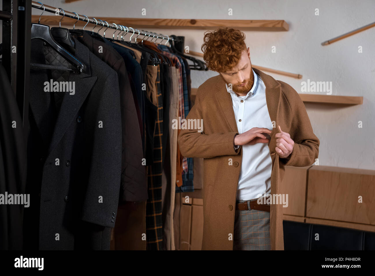 Man wearing an overcoat hi-res stock photography and images - Alamy