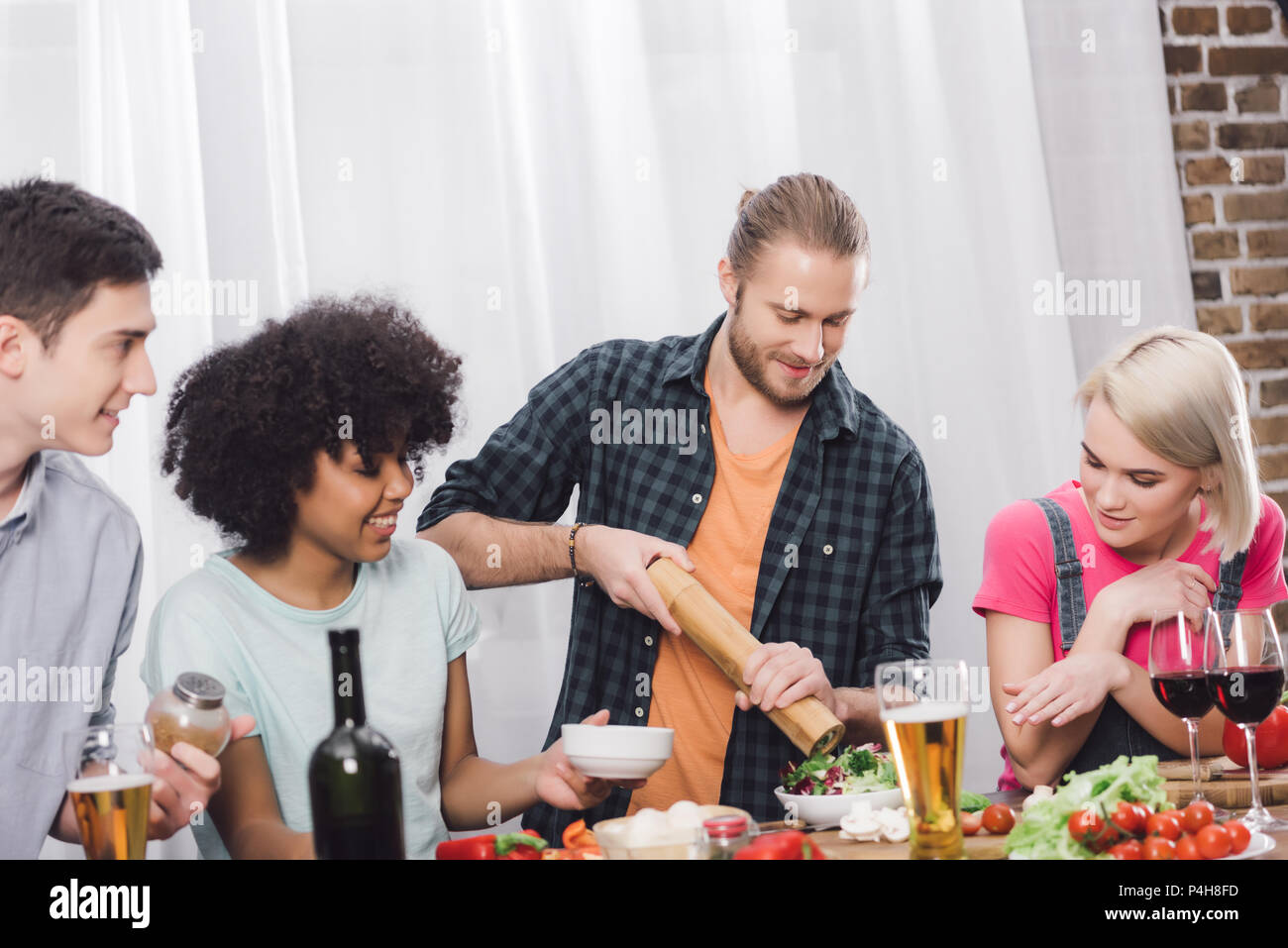 man adding spice to food with pepper grinder Stock Photo - Alamy