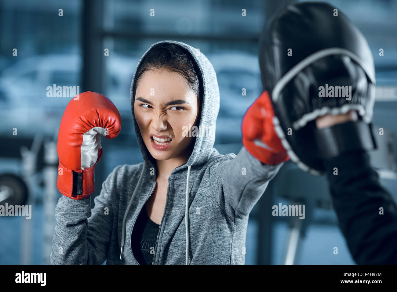 agressive young female boxer training at gym Stock Photo - Alamy