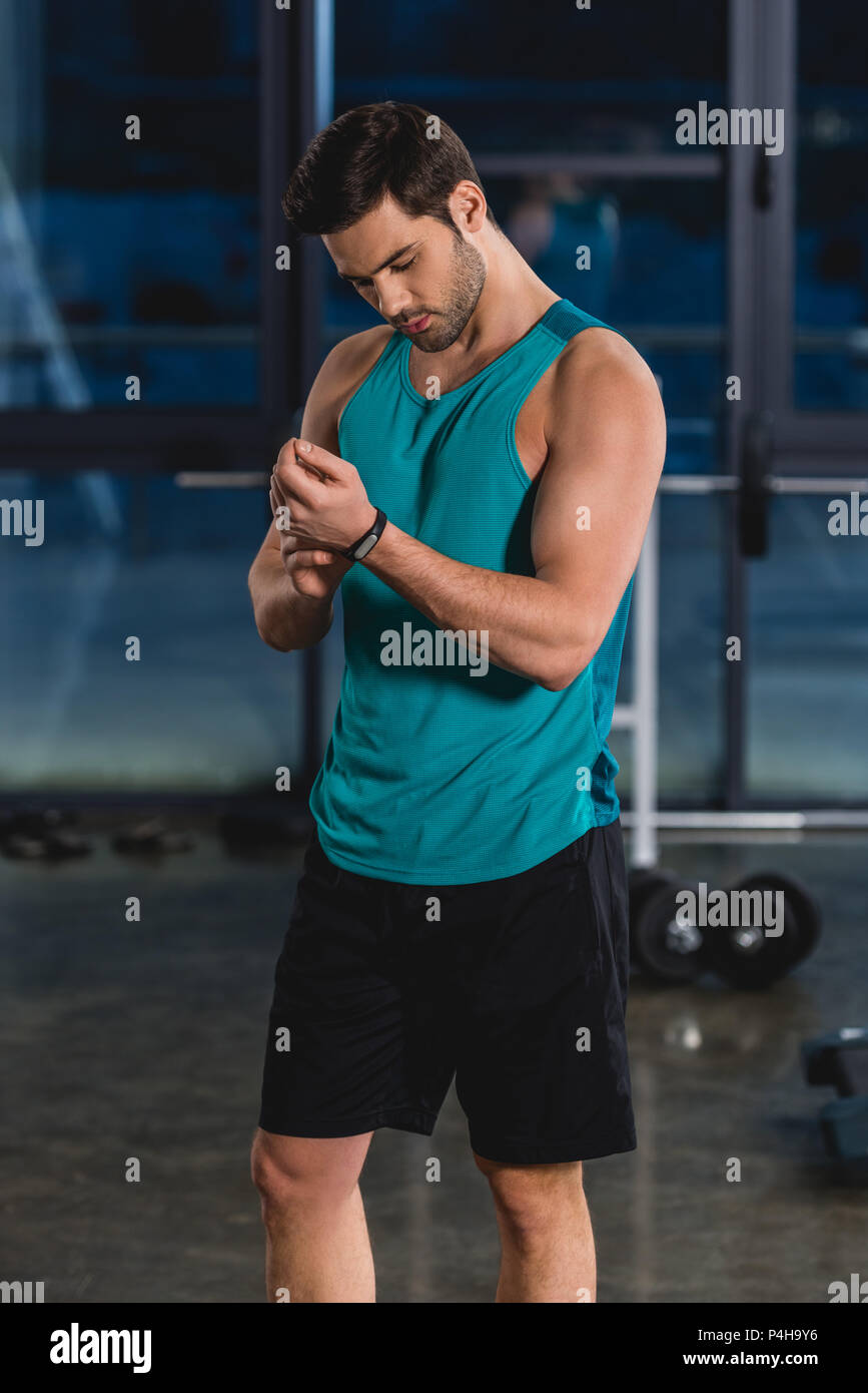 sportsman with fitness tracker in sports hall Stock Photo - Alamy