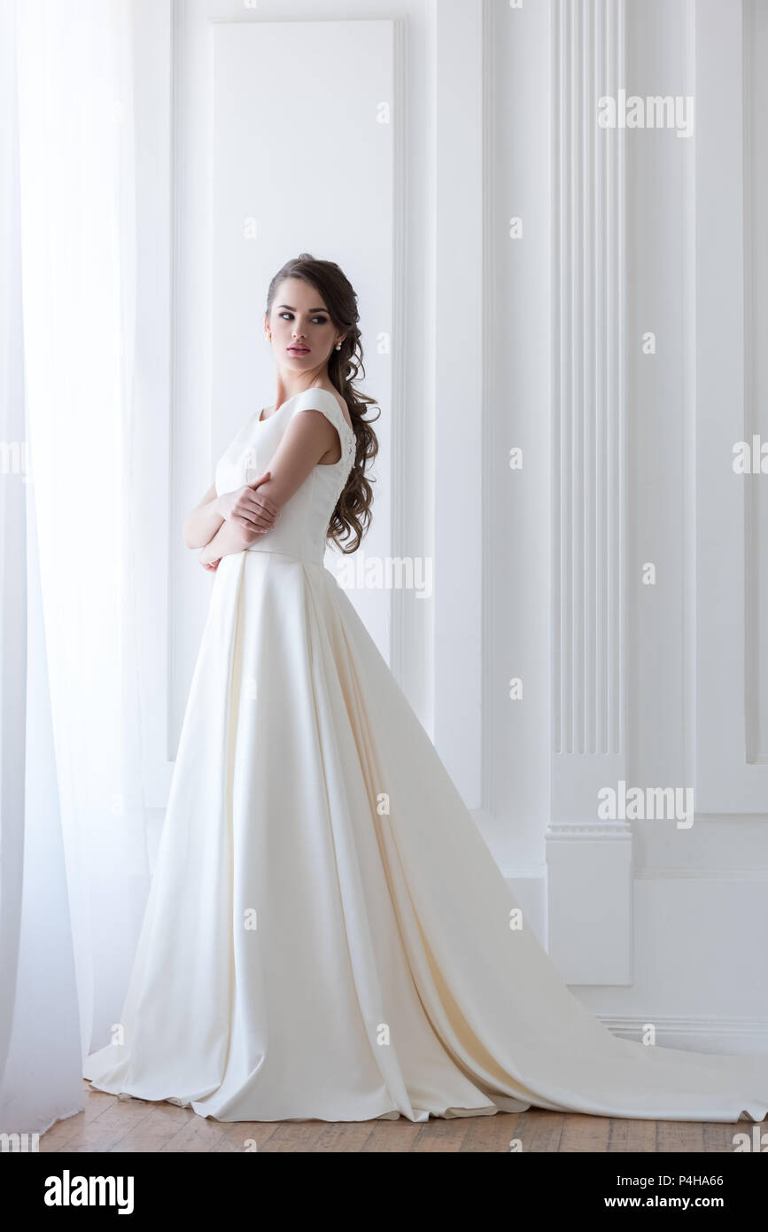 beautiful elegant bride in white wedding dress Stock Photo - Alamy