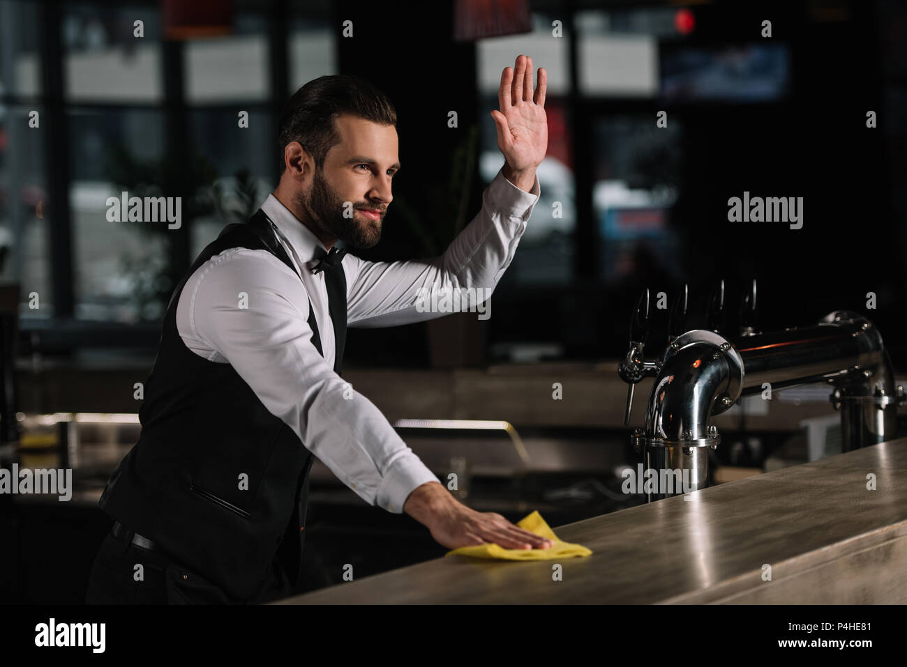 Bartender waving hi-res stock photography and images - Alamy