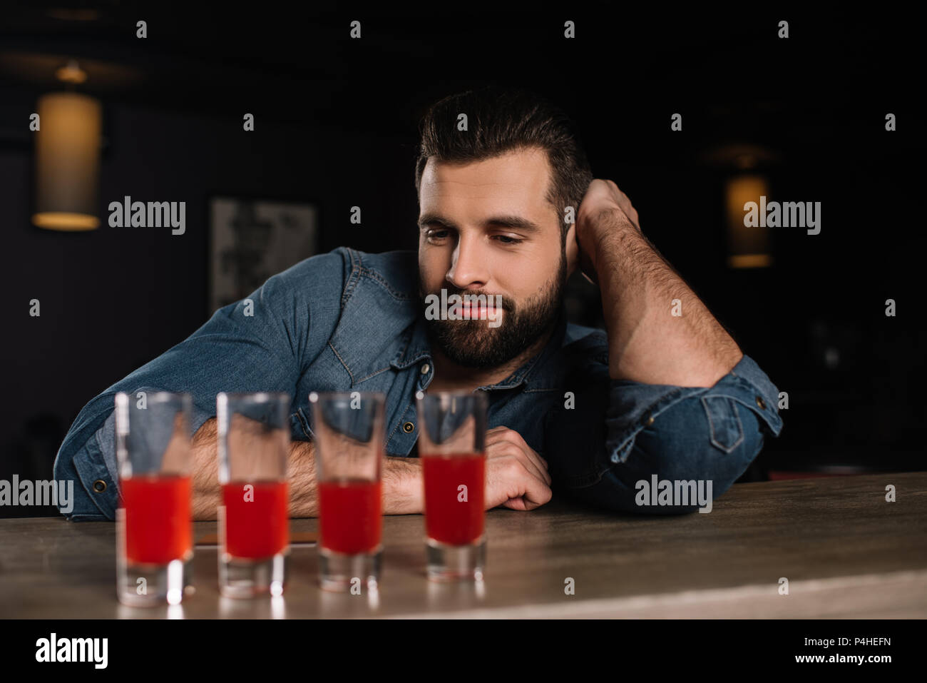 Handsome man leaning on counter hi-res stock photography and images - Alamy