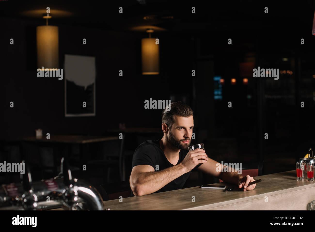 Man sitting at bar hi-res stock photography and images - Alamy