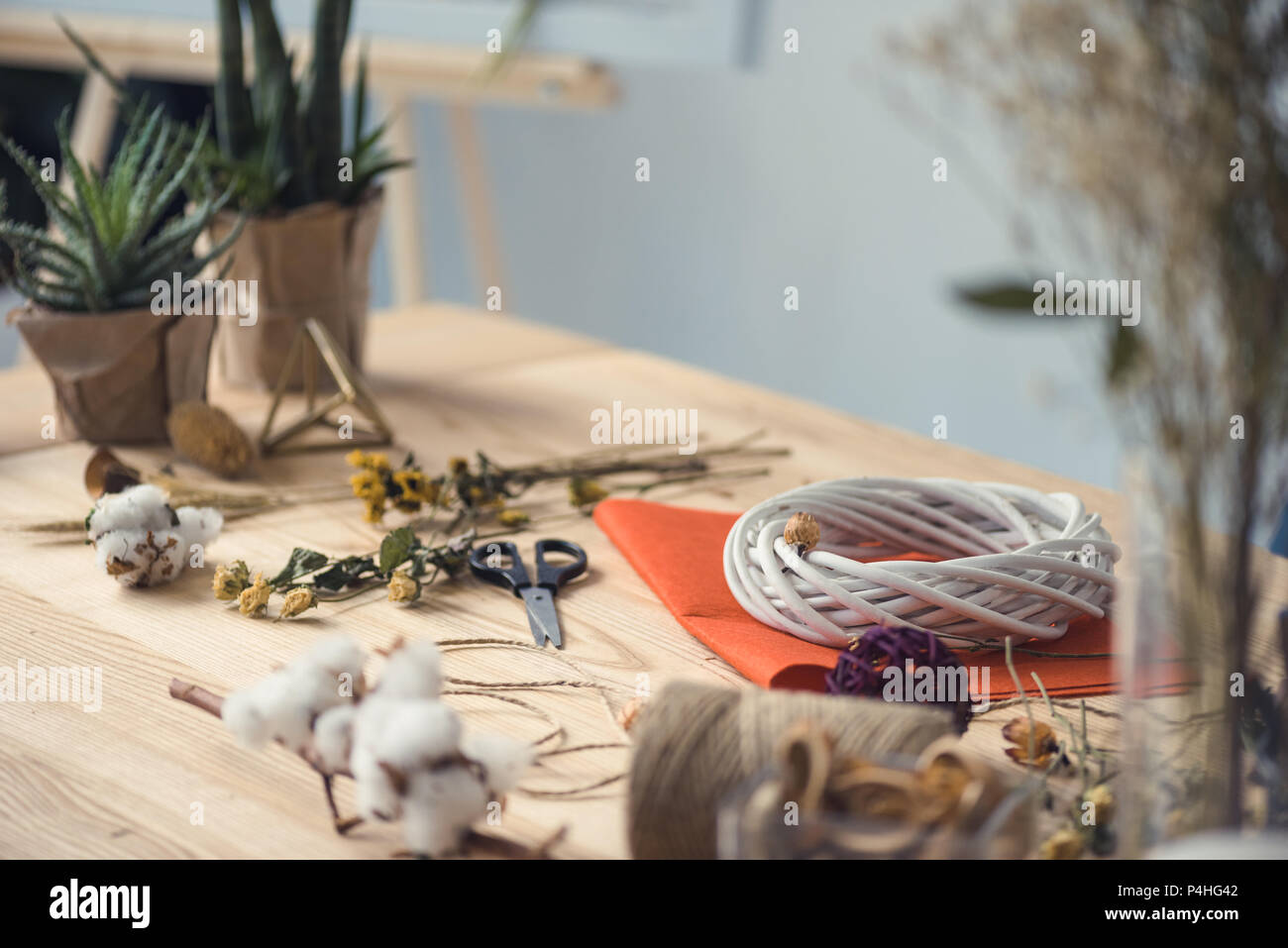 florist workplace with dry flowers, wreath and different supplies Stock ...