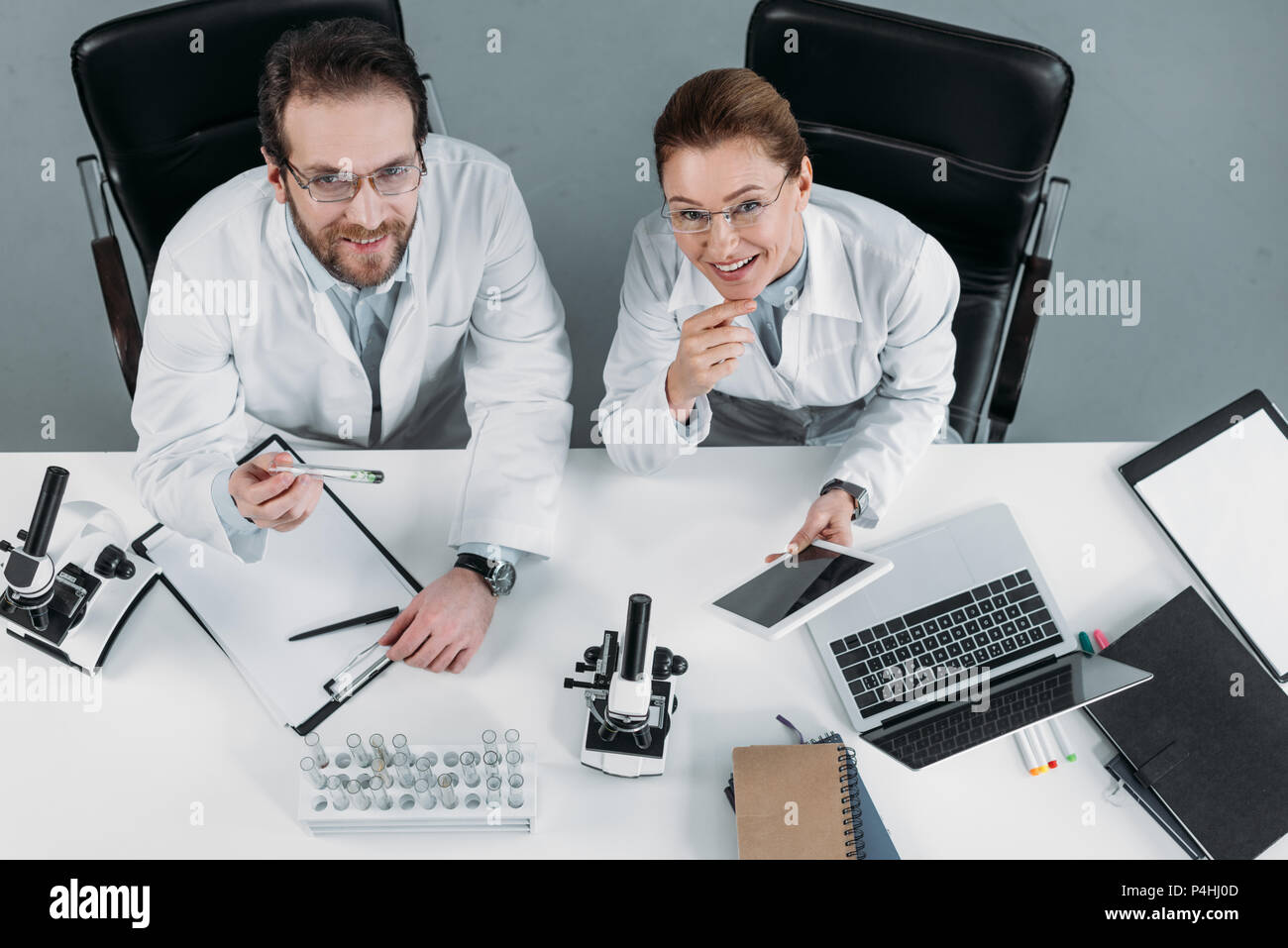 Scientists working in laboratory network hi-res stock photography and ...