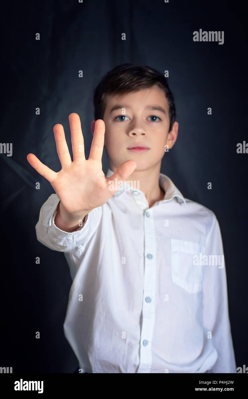 Stop a boy's hand a sign of discrimination or a violent violence symbol ...