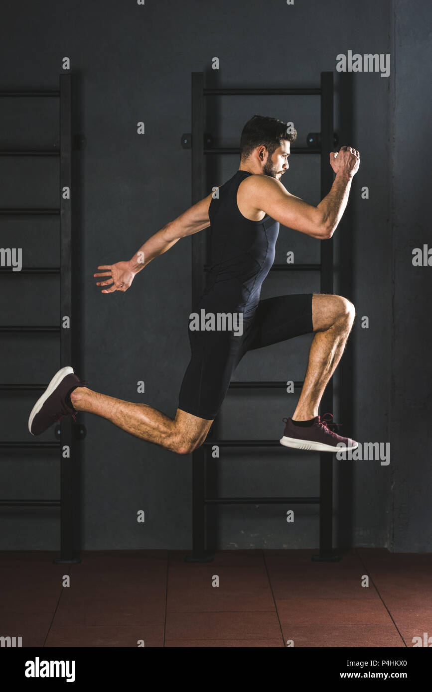 Side view young sportsman jumping hi-res stock photography and images ...