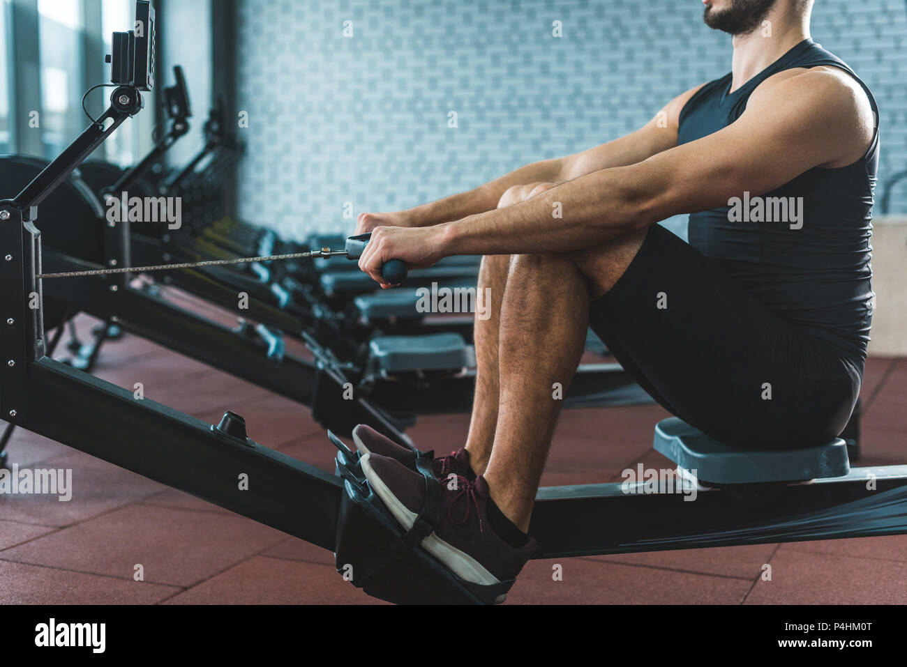 Male on rowing machine hi-res stock photography and images - Alamy