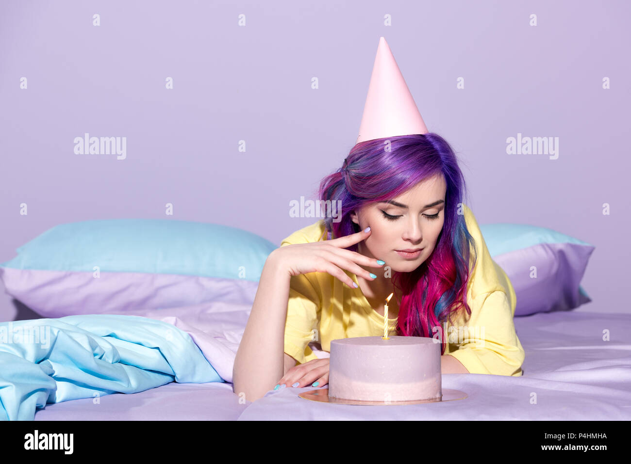 beautiful young woman with birthday cake in bed Stock Photo - Alamy