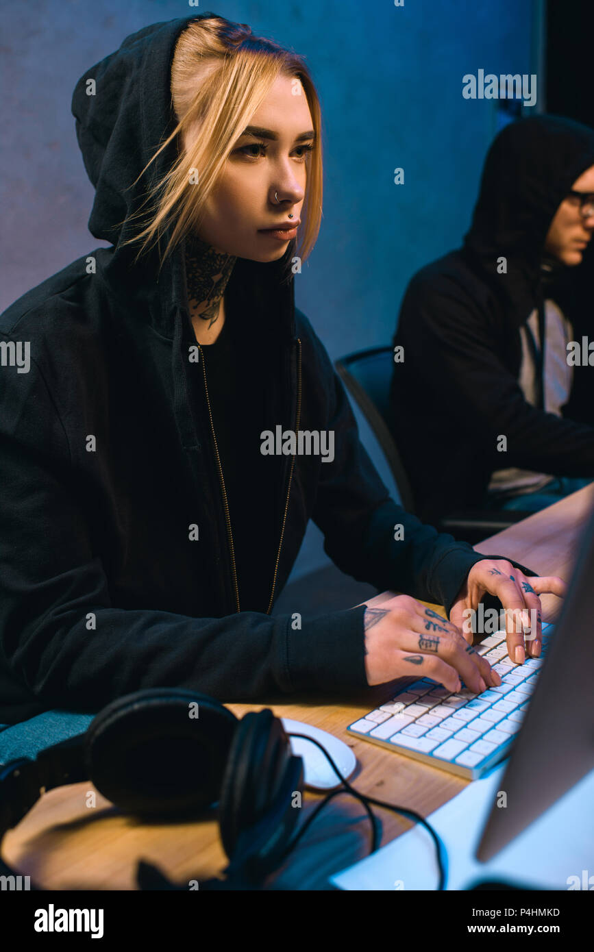 Male female hacker working together hi-res stock photography and images ...