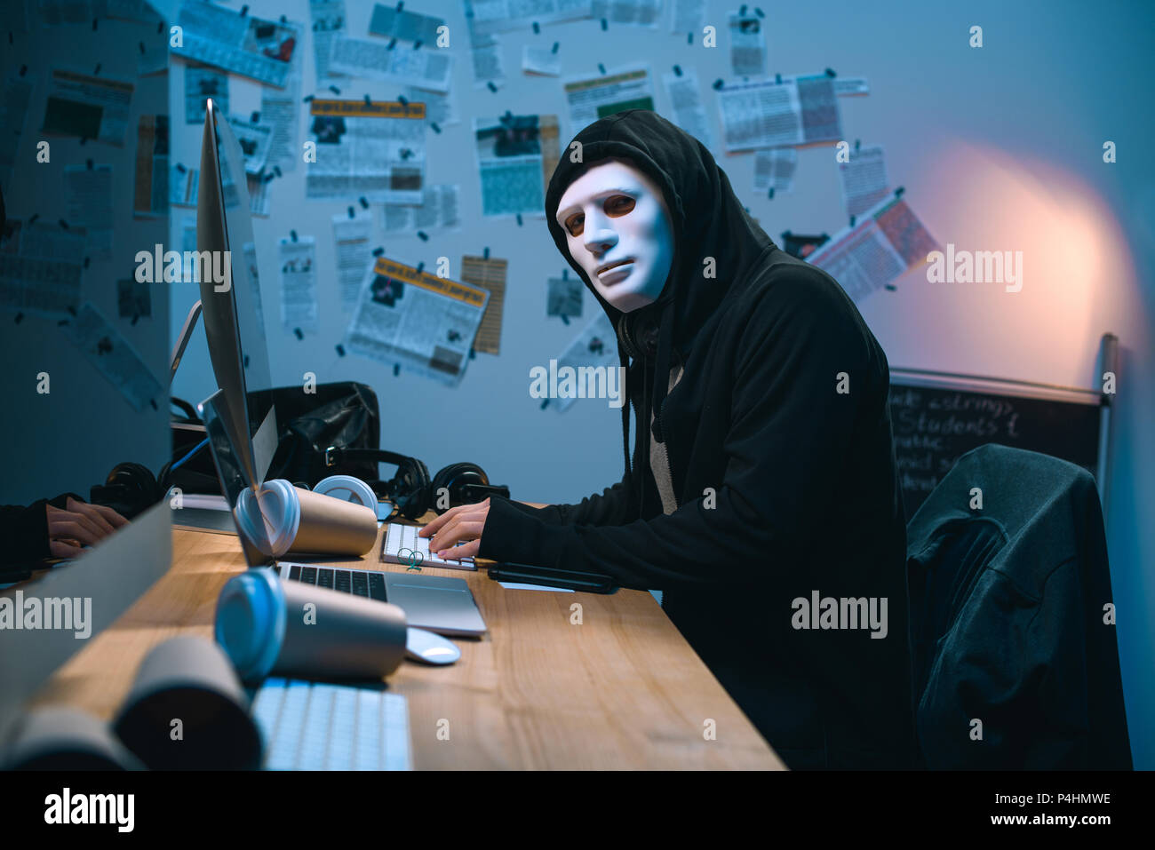 Hacker in mask hi-res stock photography and images - Alamy