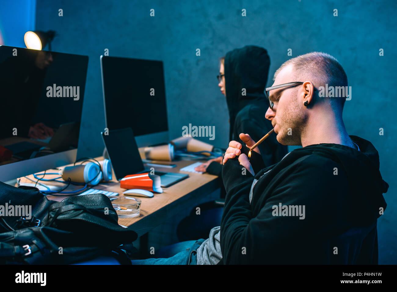 Male female hacker working together hi-res stock photography and images ...