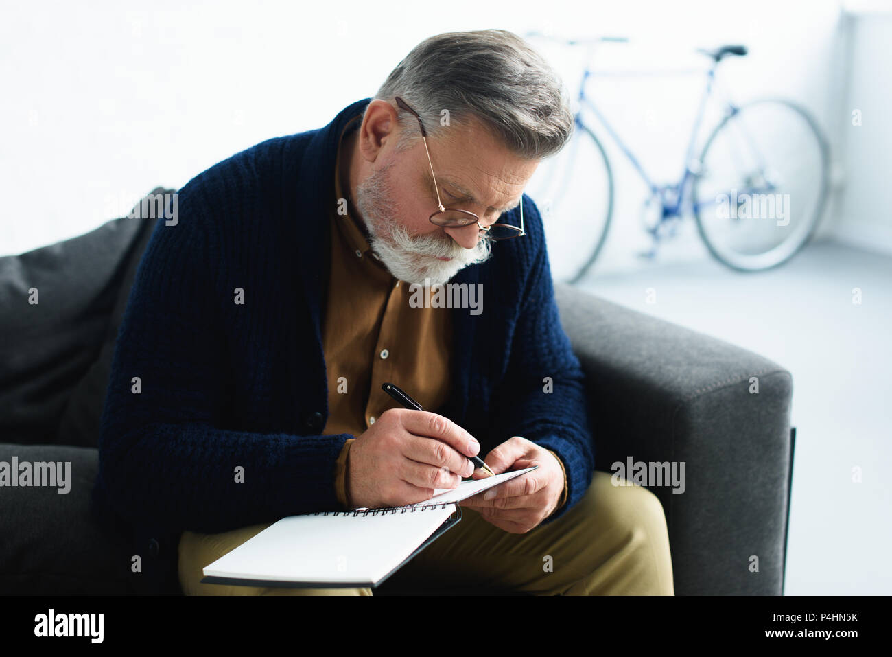 Focused male taking notes hi-res stock photography and images - Alamy