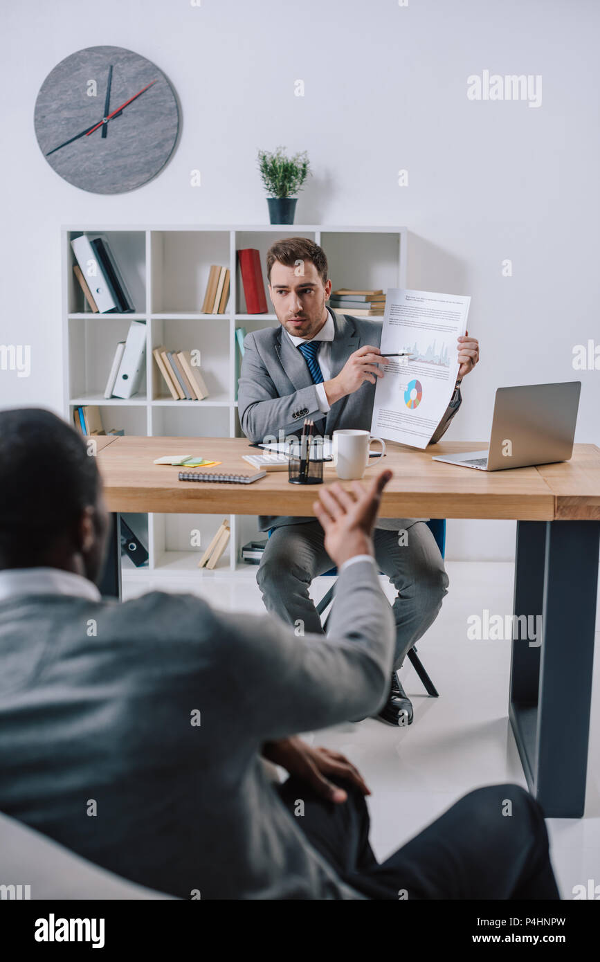Financial adviser showing presentation to client Stock Photo - Alamy