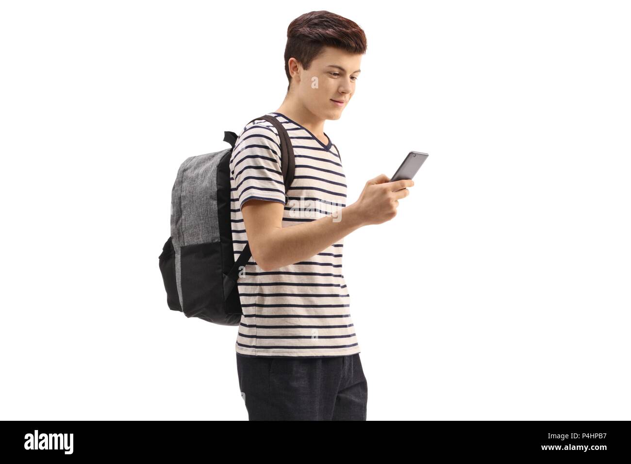 Teenage student with a phone isolated on white background Stock Photo ...