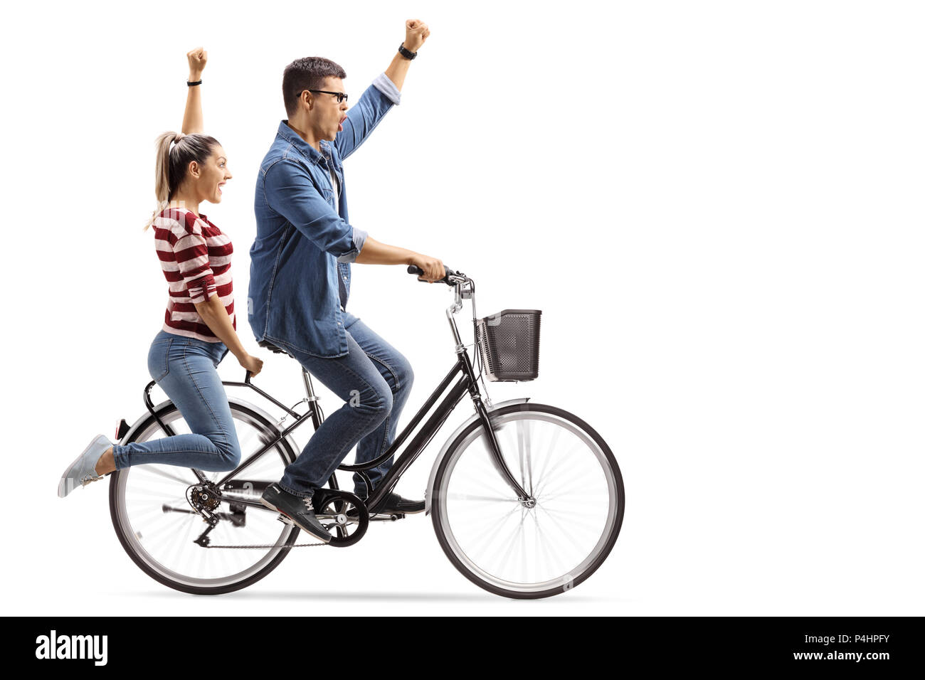 Young couple riding a bicycle and gesturing happiness isolated on white ...