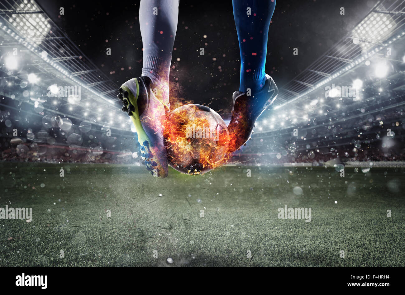 Soccer players with soccerball on fire at the stadium during the match ...