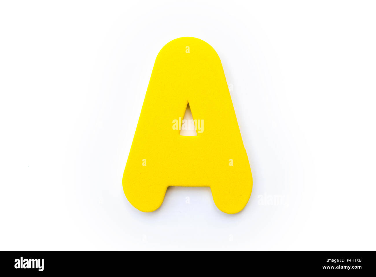 Yellow letter A over a white background Stock Photo - Alamy