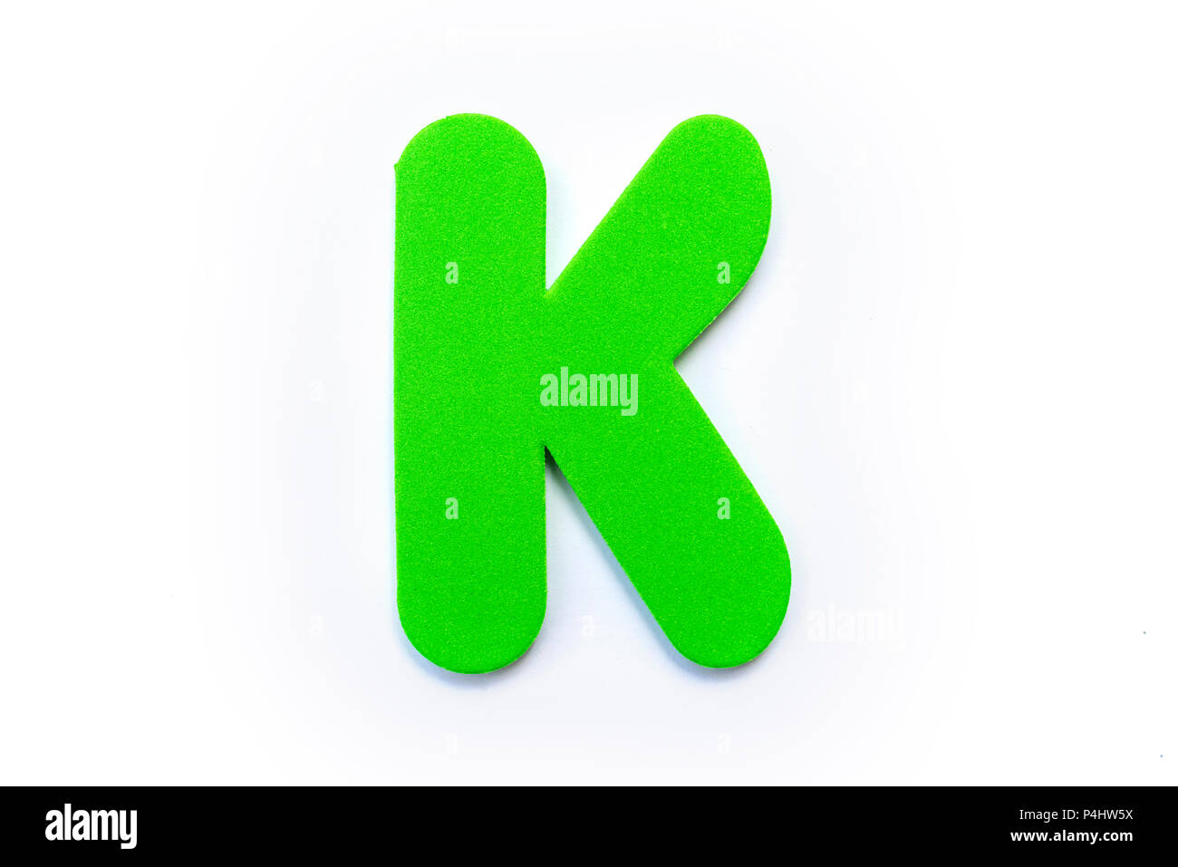 Green Letter K over a white background Stock Photo - Alamy