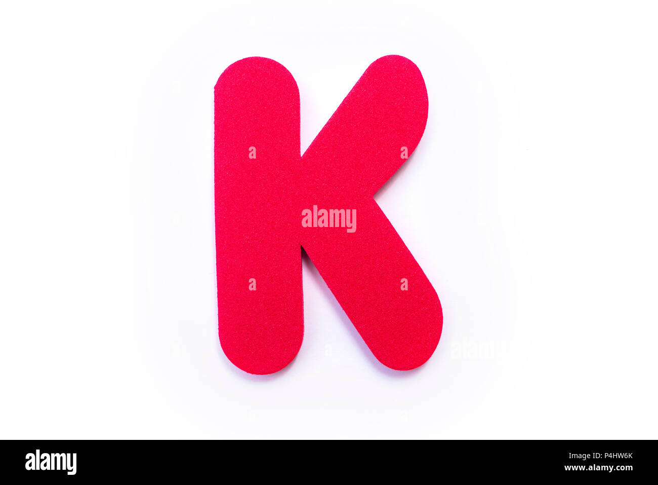 Red Letter K over a white background Stock Photo - Alamy