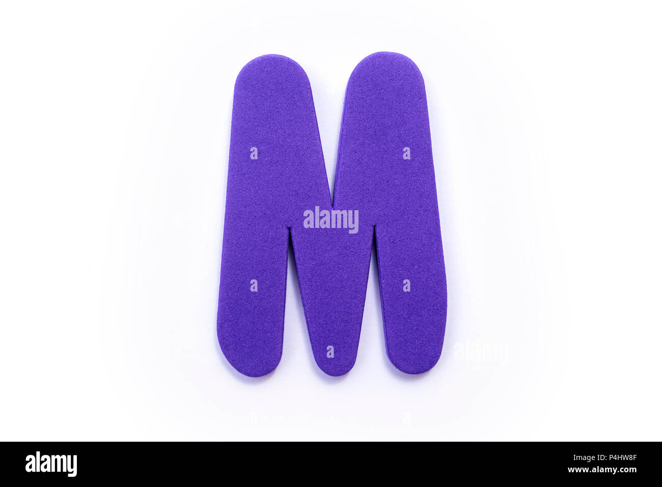 Purple Letter M over a white background Stock Photo - Alamy