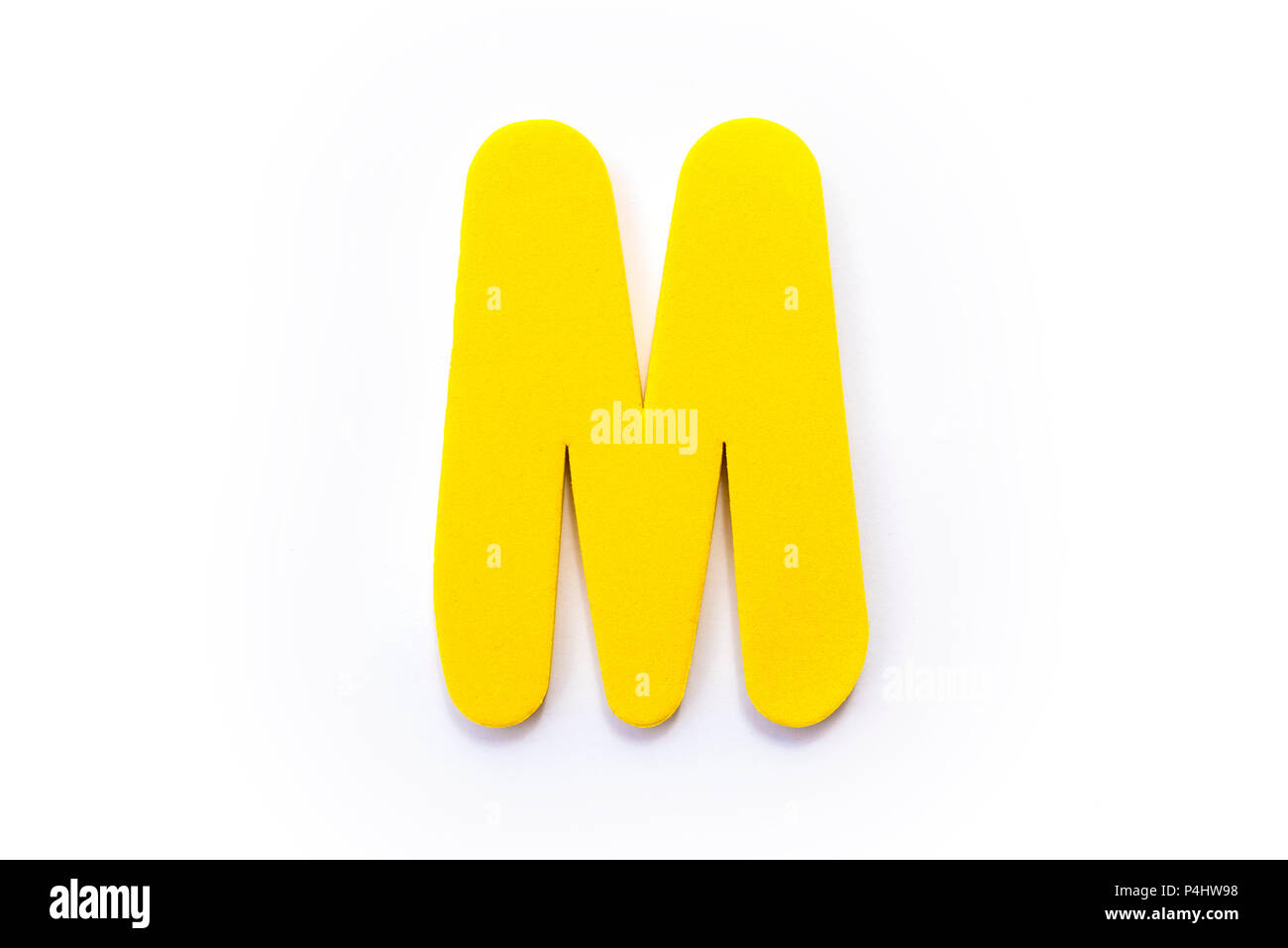 Yellow Letter M over a white background Stock Photo - Alamy