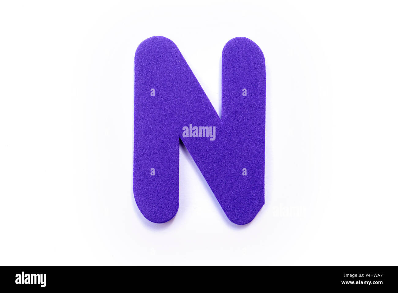 Purple Letter N over a white background Stock Photo - Alamy